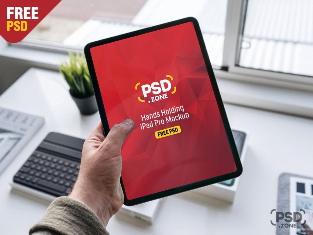 Hand Holding New iPad Pro Mockup - PSD Zone